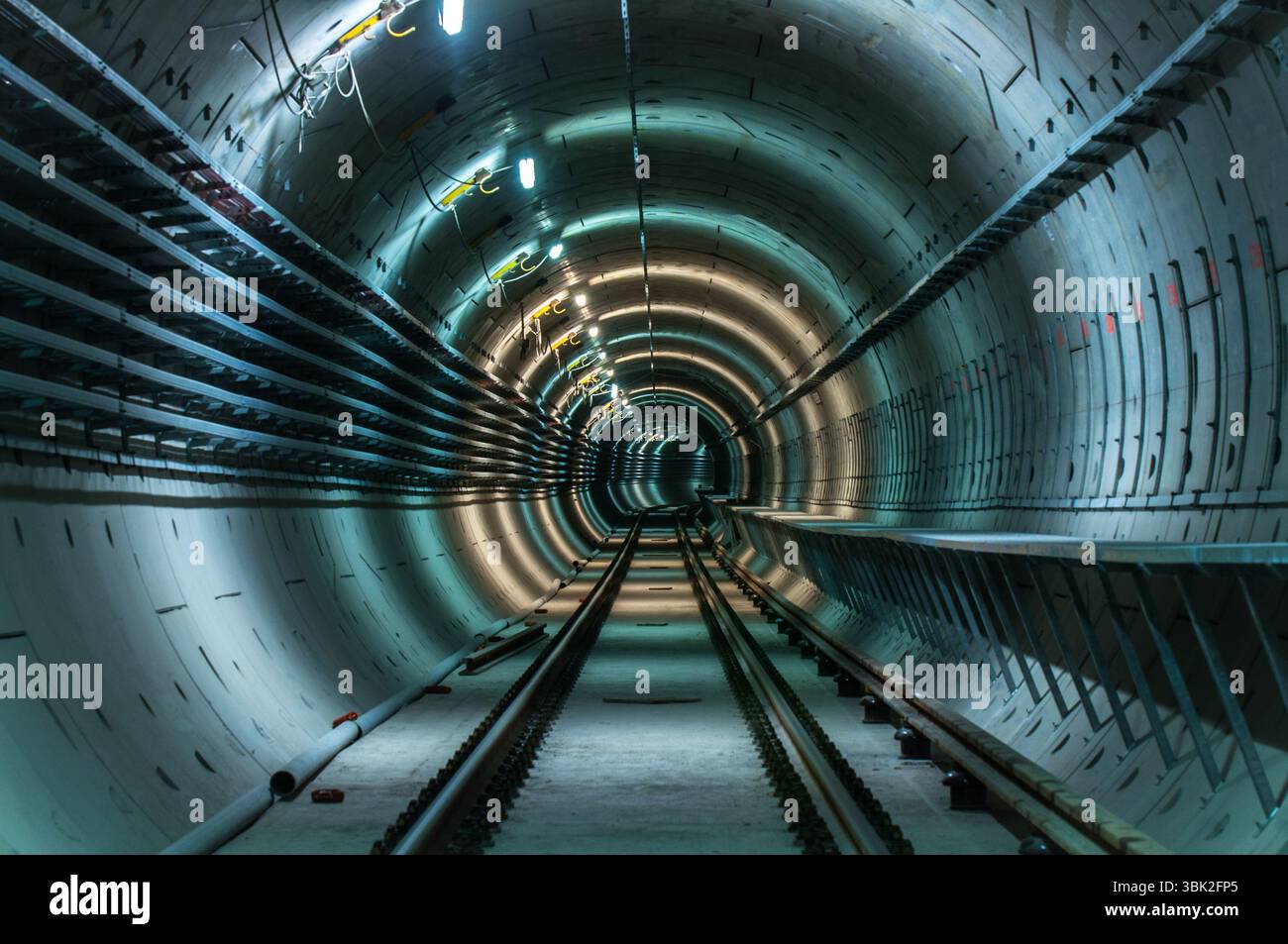 Underground facility with a big tunnel leading deep down Stock Photo ...