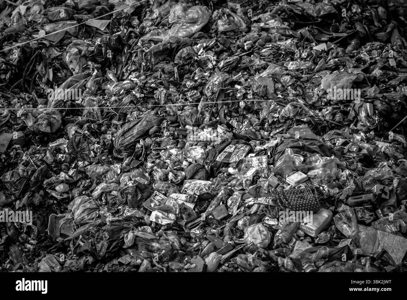 Large heap of garbage inside a processing plant Stock Photo - Alamy