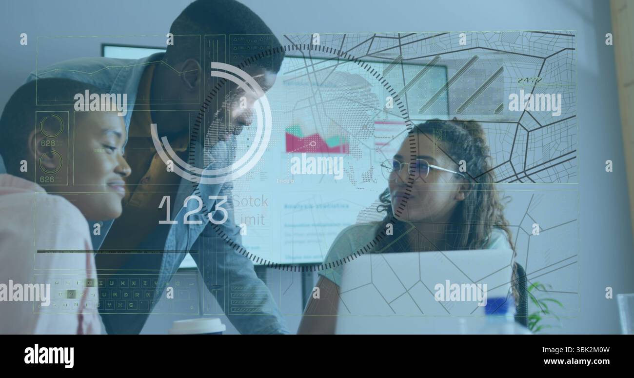 Analyzing data three coworkers leaning over office table, using laptop ...