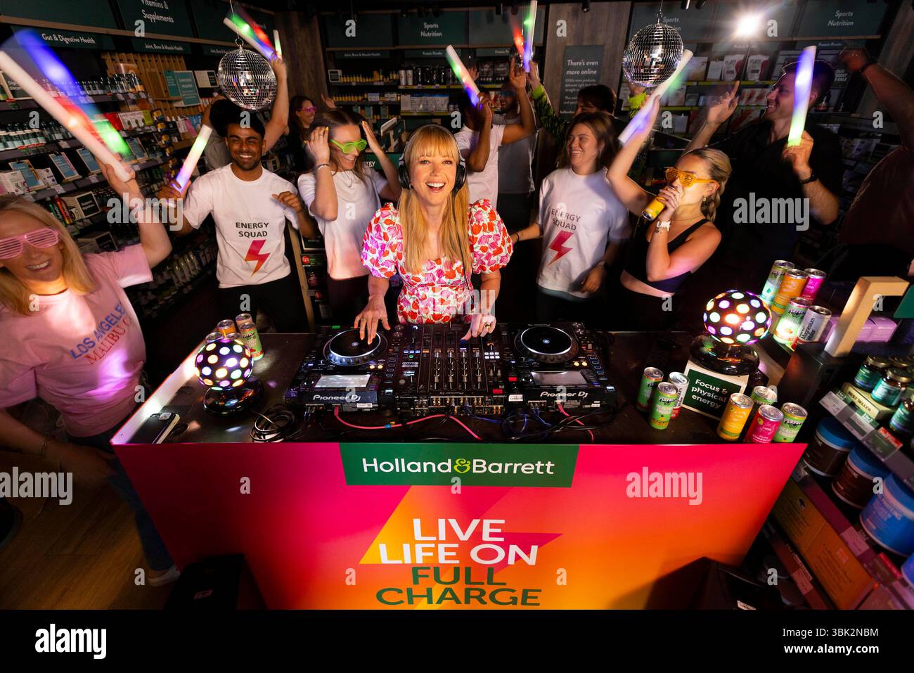 EDITORIAL USE ONLY DJ Sara Cox performs a set at Holland and Barrett on ...