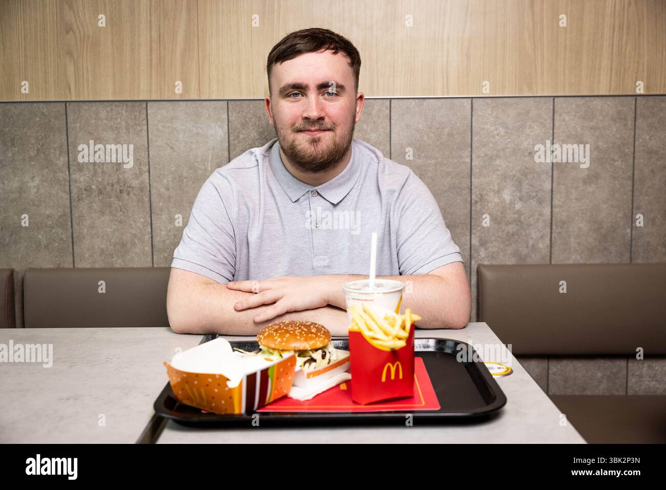 EDITORIAL USE ONLY World number two darts player Luke Littler visits his local McDonald's in ...