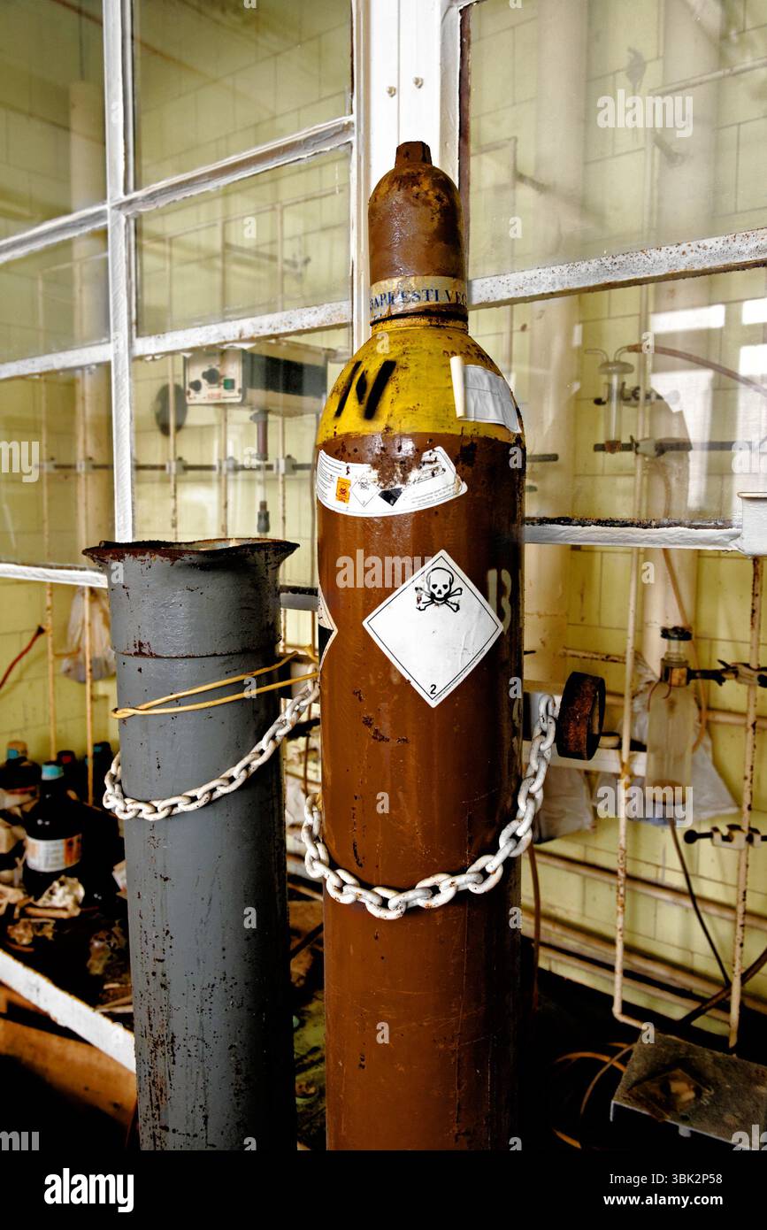 Old and used gas canister indoors Stock Photo - Alamy