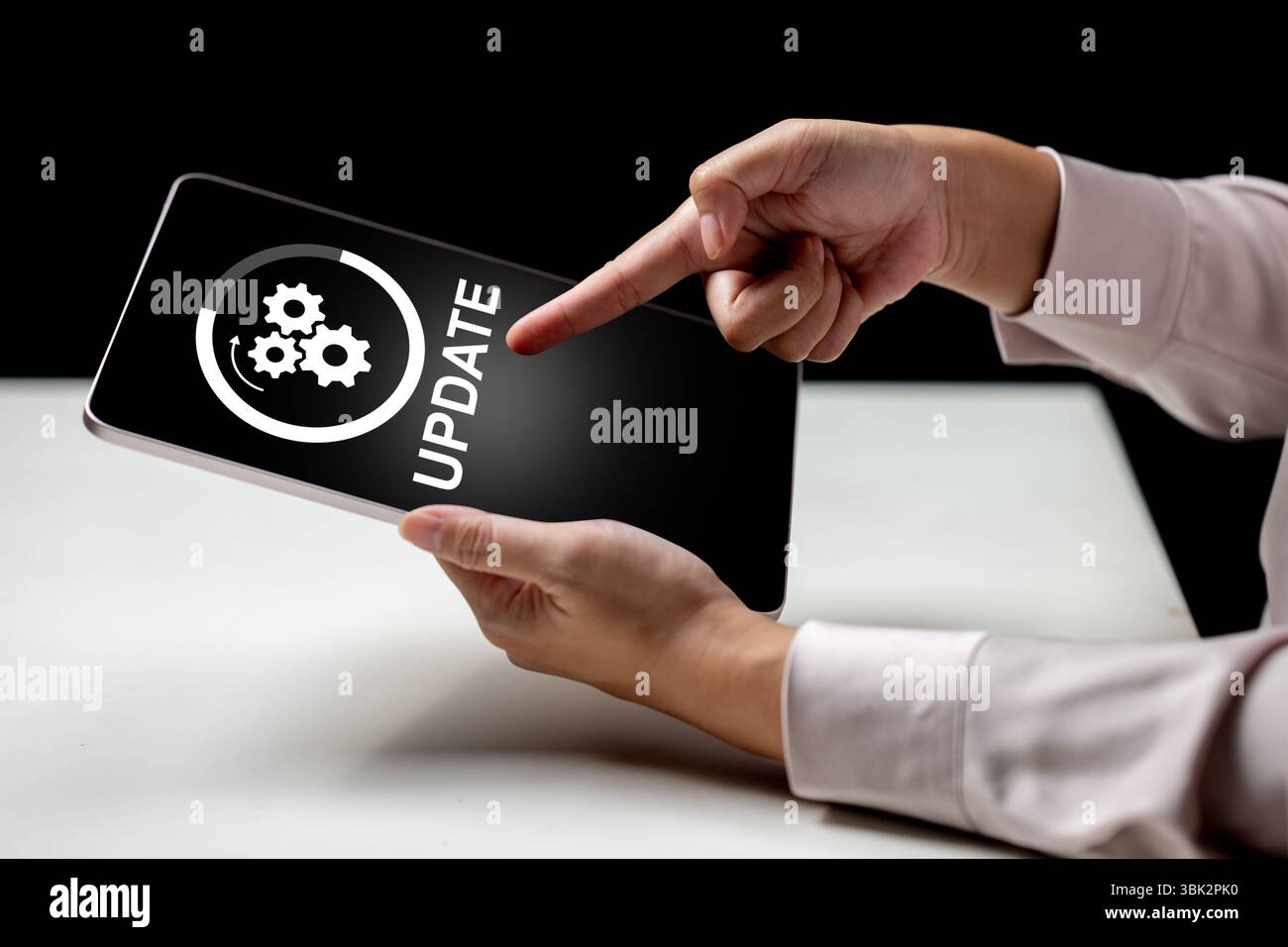 Businesswoman showing an update icon on the tablet screen. Technology ...