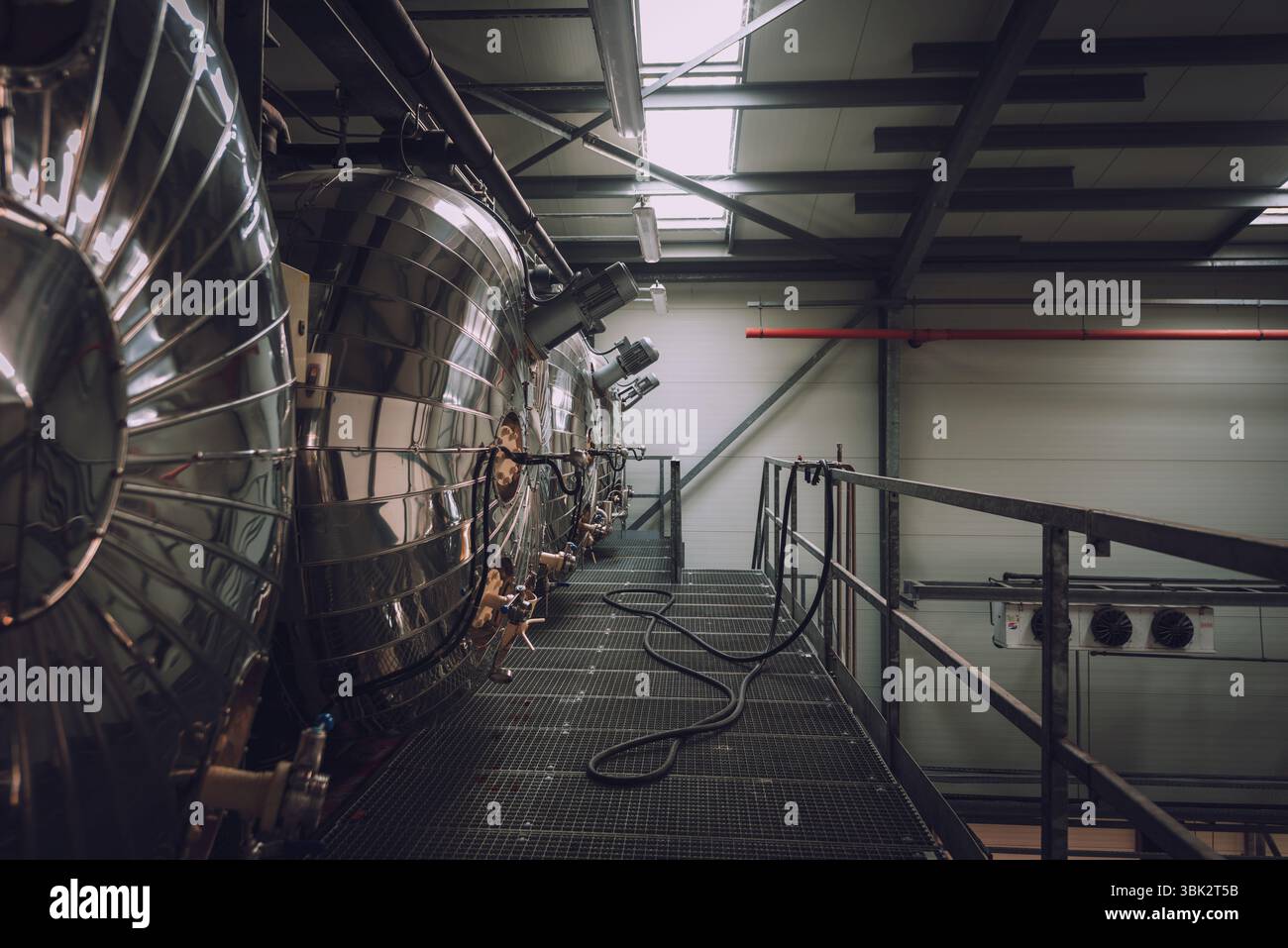 Industrial interior of an alcohol factory with silos Stock Photo - Alamy