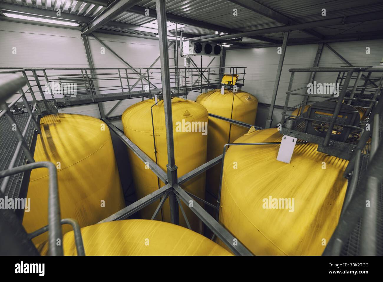 Industrial interior with welded silos from above Stock Photo - Alamy
