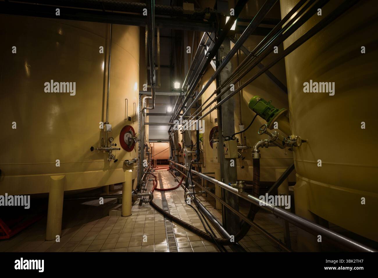 Industrial interior with welded silos angle shot Stock Photo - Alamy