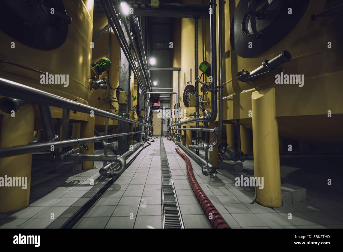 Industrial interior with welded silos angle shot Stock Photo - Alamy