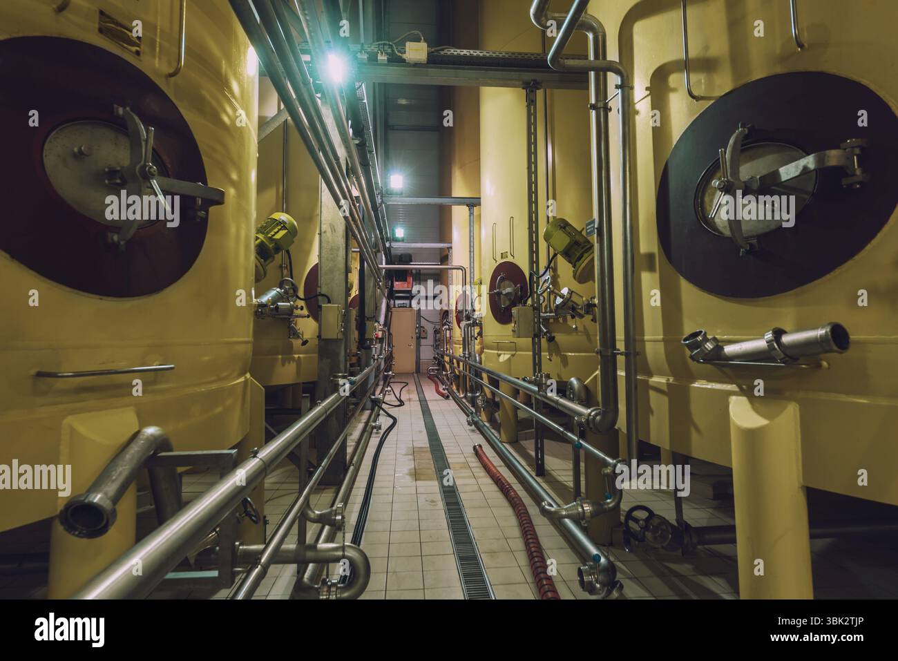 Industrial interior with welded silos angle shot Stock Photo - Alamy