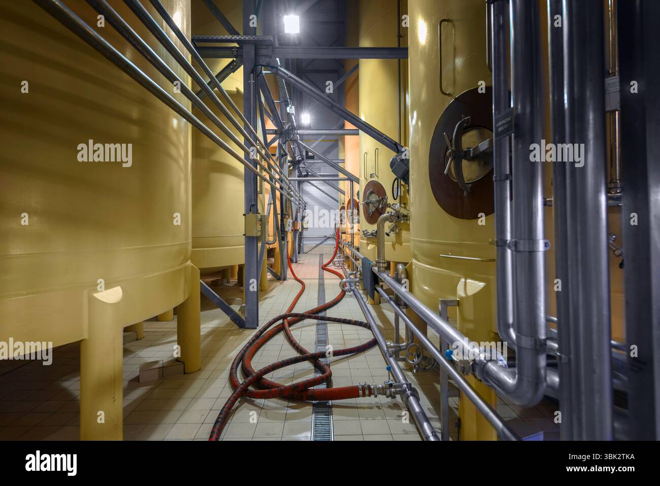 Large industrial yellow silos in modern factory interior Stock Photo ...