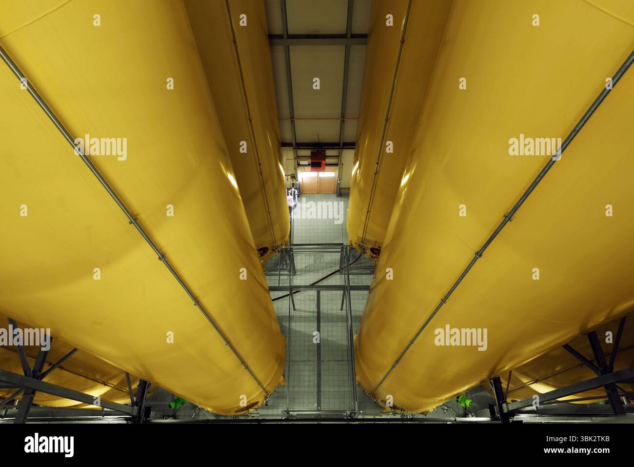Industrial interior with welded silos from above Stock Photo - Alamy