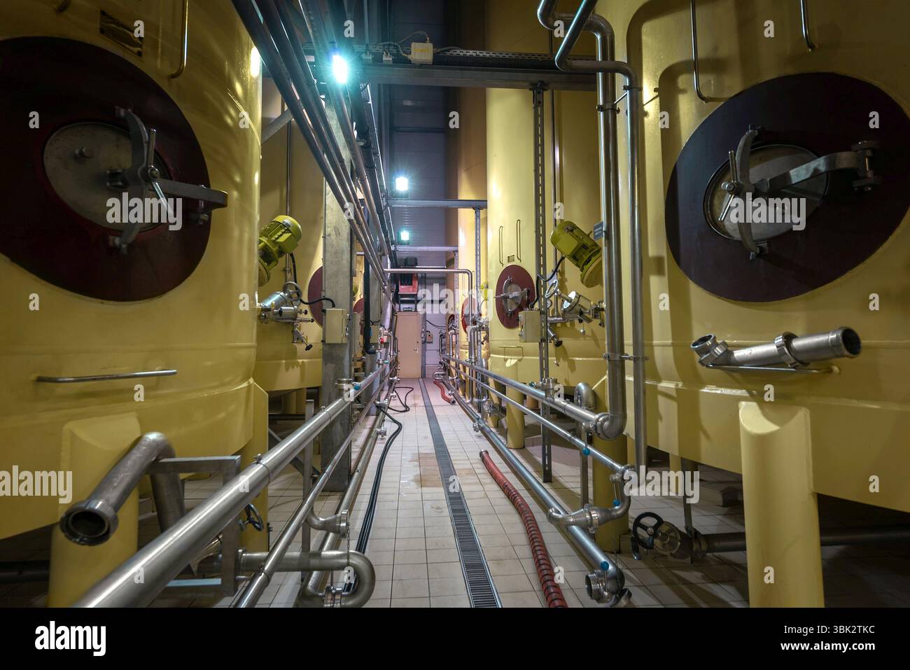 Industrial interior with welded silos angle shot Stock Photo - Alamy