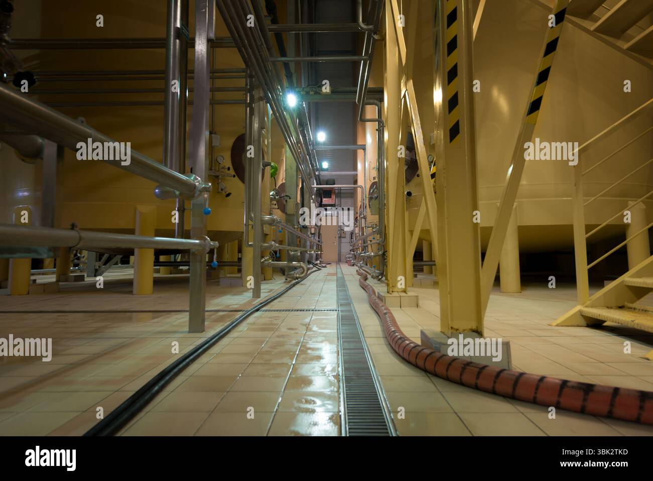 Industrial interior with welded silos angle shot Stock Photo - Alamy