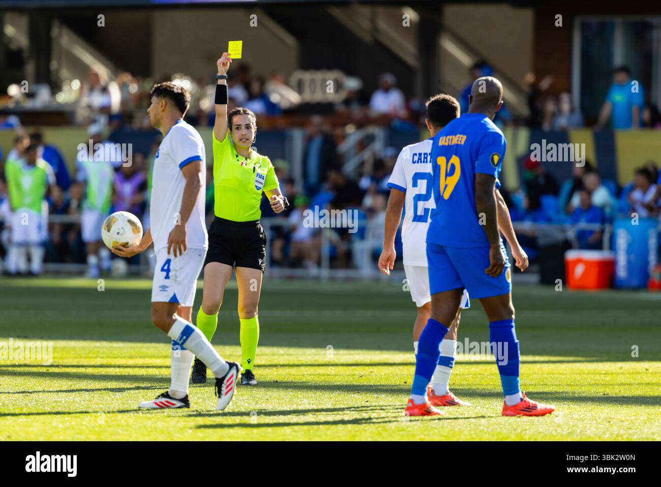 SAN JOSE, CA - JUNE 17: Referee Katia Garcia hands out a yellow card to ...