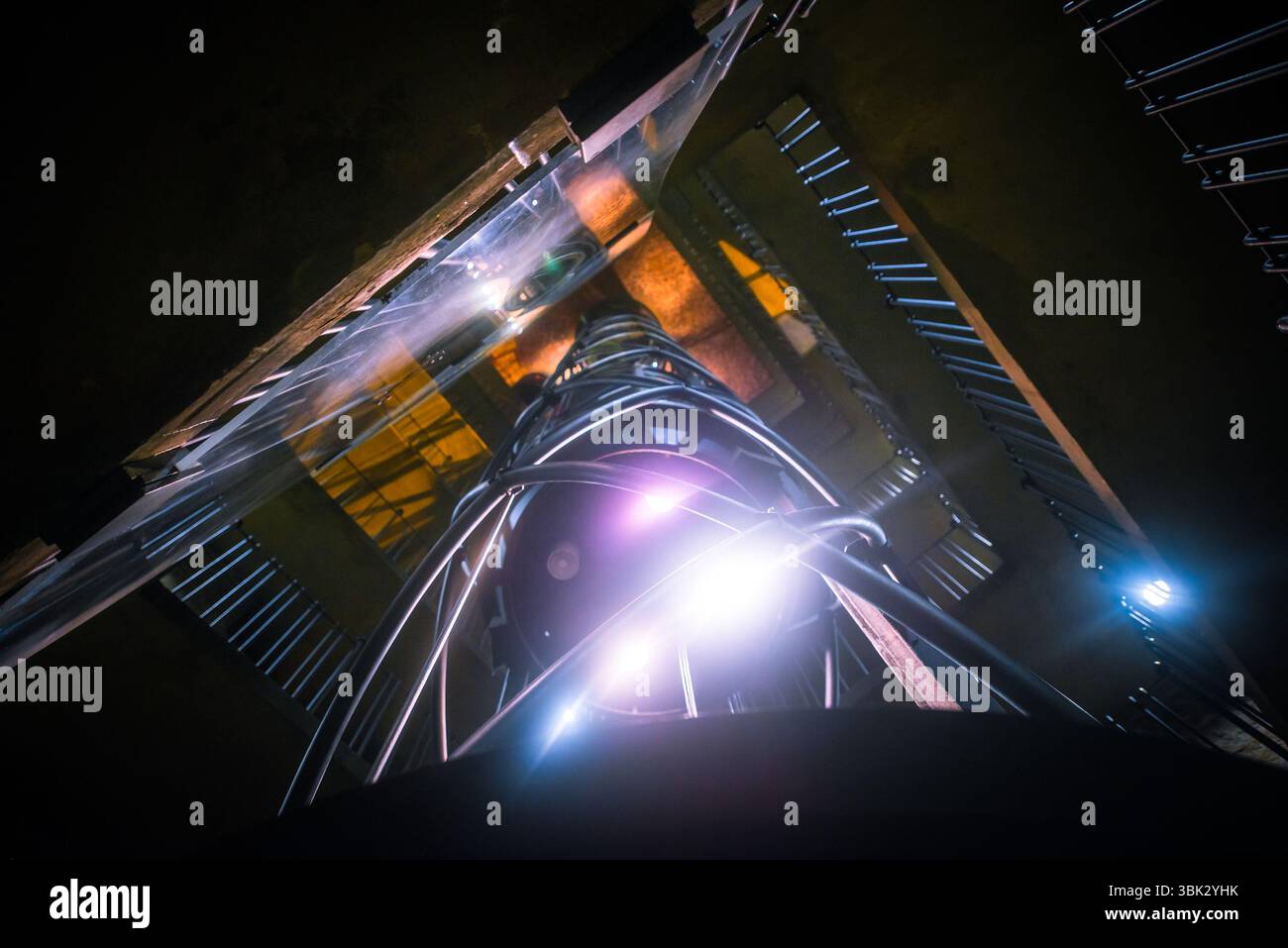 Clock tower interior with elevator angle shot Stock Photo - Alamy