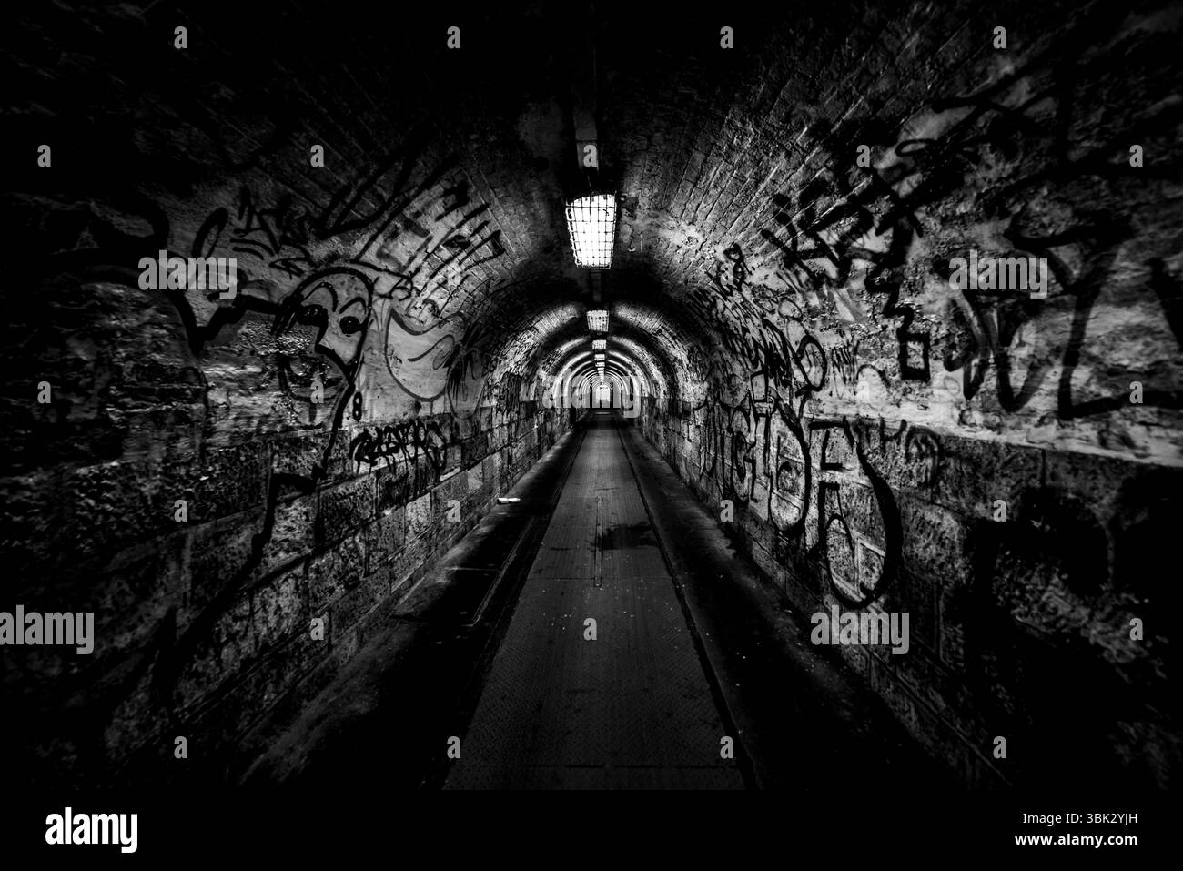 Dark and long undergorund passage with light hi-res stock photography ...