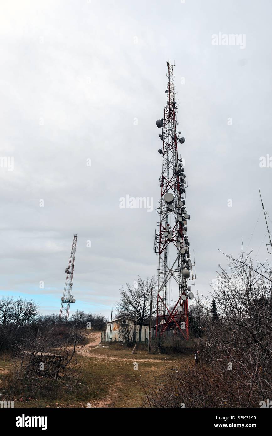Tall Communication towers with large antennas outdoors Stock Photo - Alamy