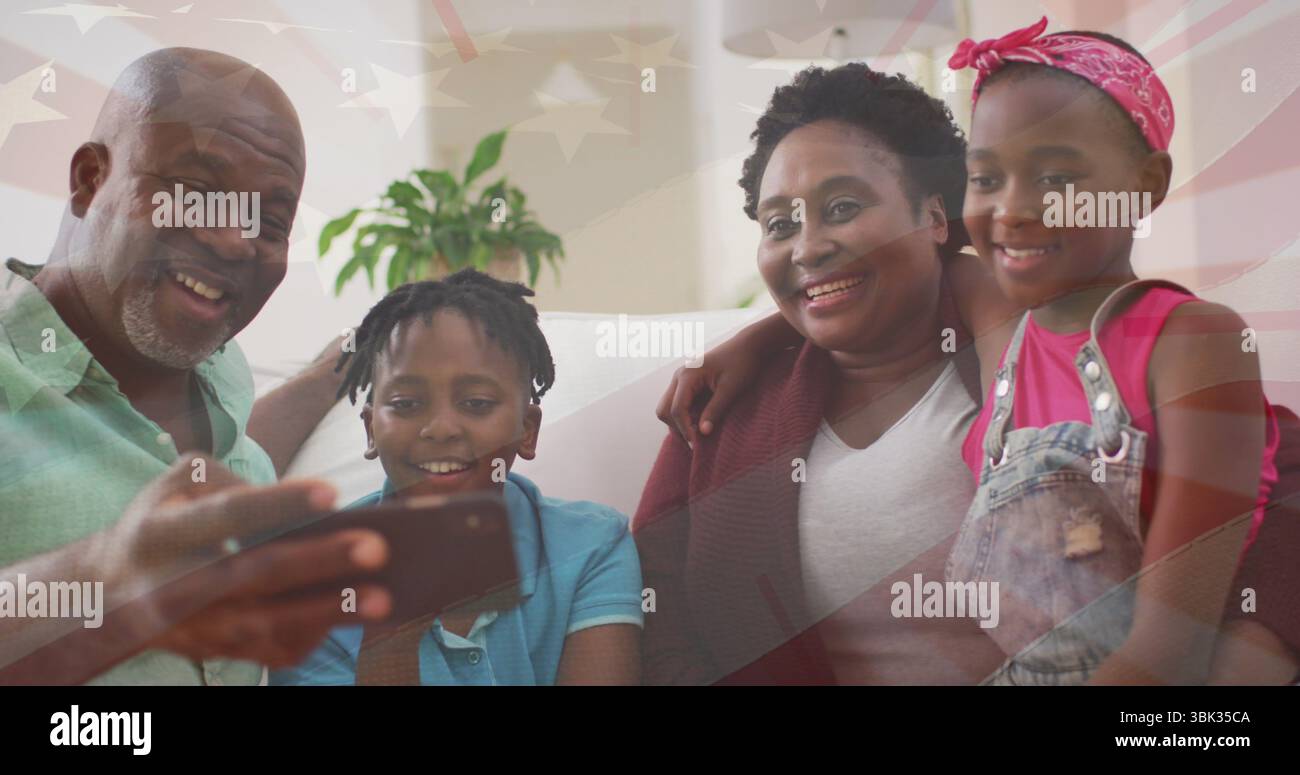Gathering family members watching smartphone and leaning on light sofa ...