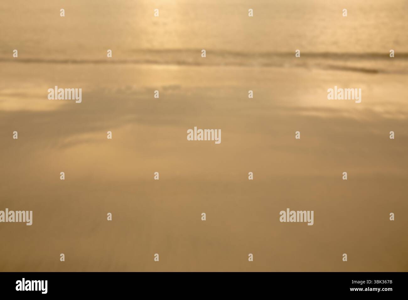 Reflective wet sand shoreline is mirroring calm sea water in flat ...