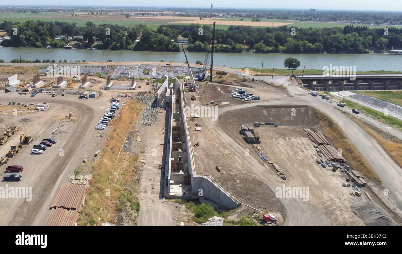An aerial view shows construction of the fish passage structure along ...
