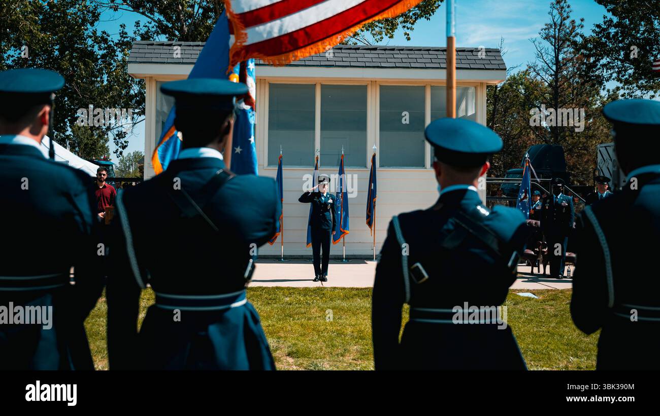 Maj. Gen. Stacy Huser (center), 20th Air Force commander salutes the ...