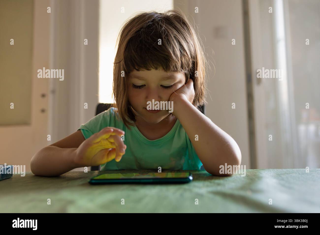 Playing games on a phone hi-res stock photography and images - Alamy