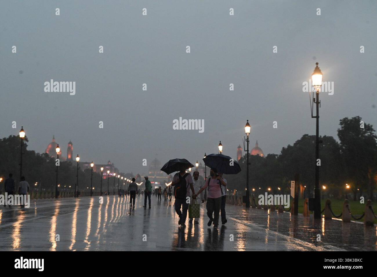 NEW DELHI, INDIA - JUNE 17: People enjoy pleasant weather after rain at the Kartavya Path, on ...