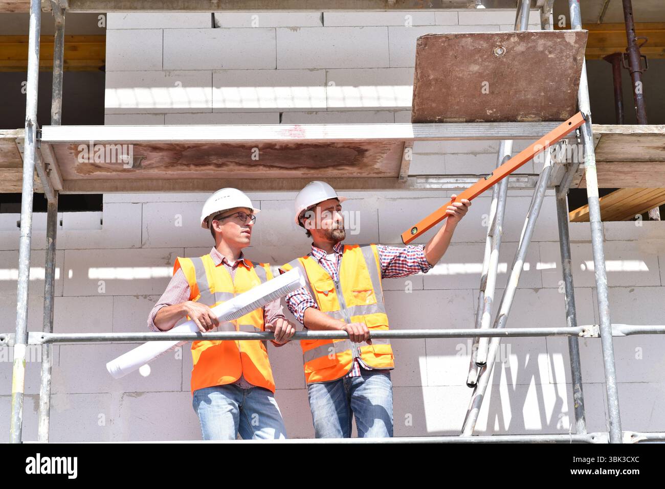 construction manager and architect on site during the construction of a ...