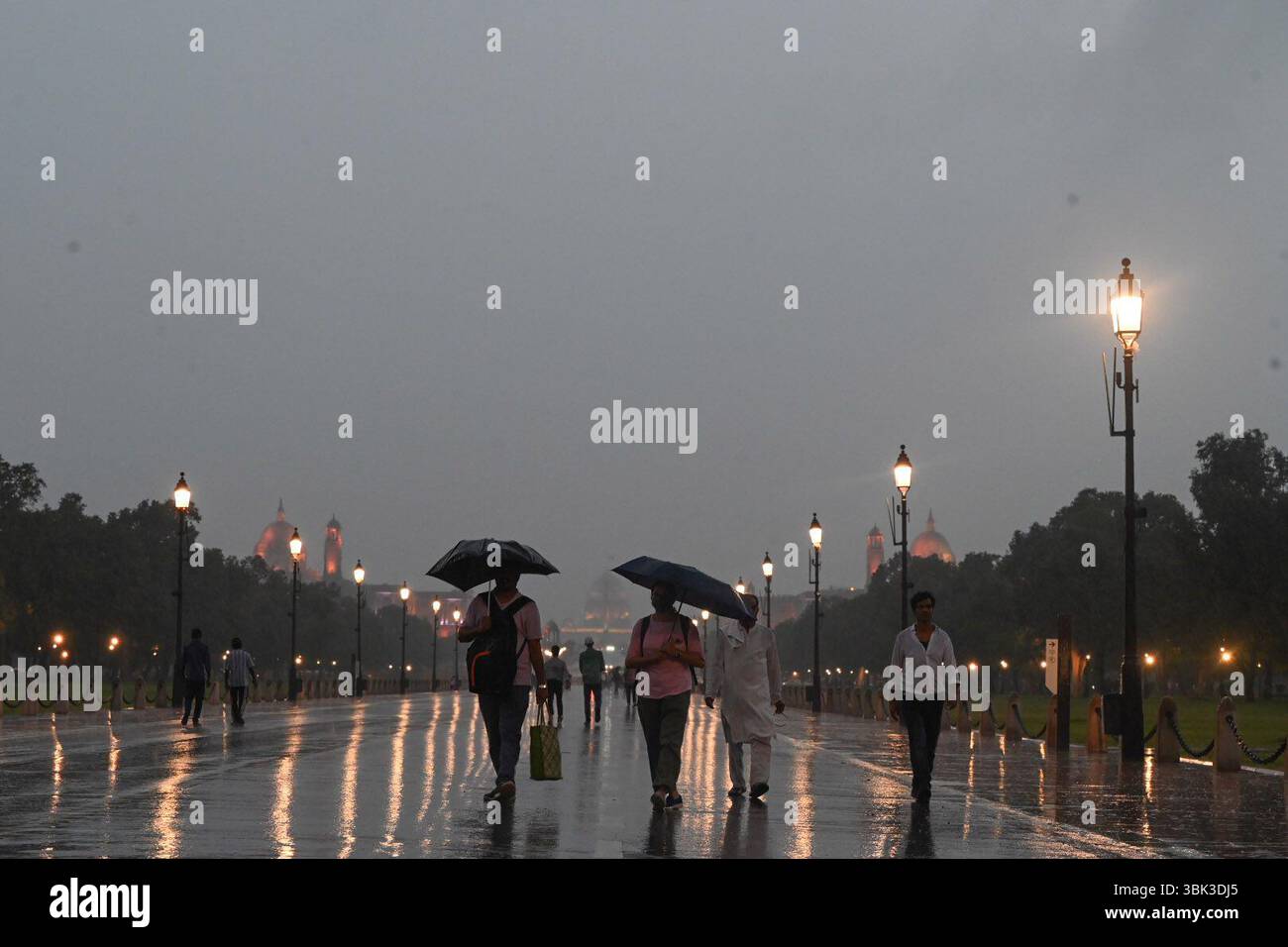 NEW DELHI, INDIA - JUNE 17: People enjoy pleasant weather after rain at the Kartavya Path, on ...