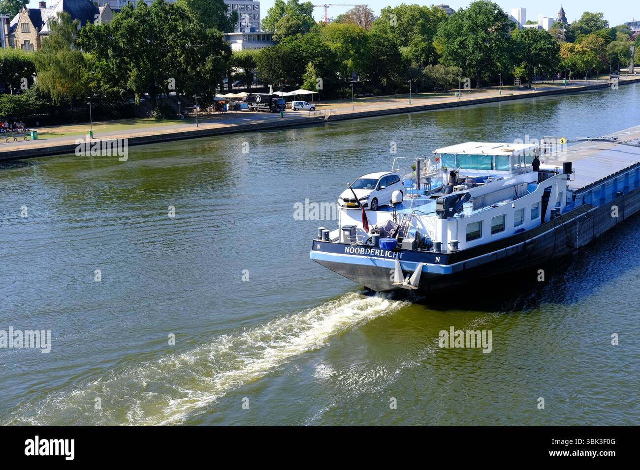 Main River Frankfurt, barges navigating, modern city skyline, bridge ...