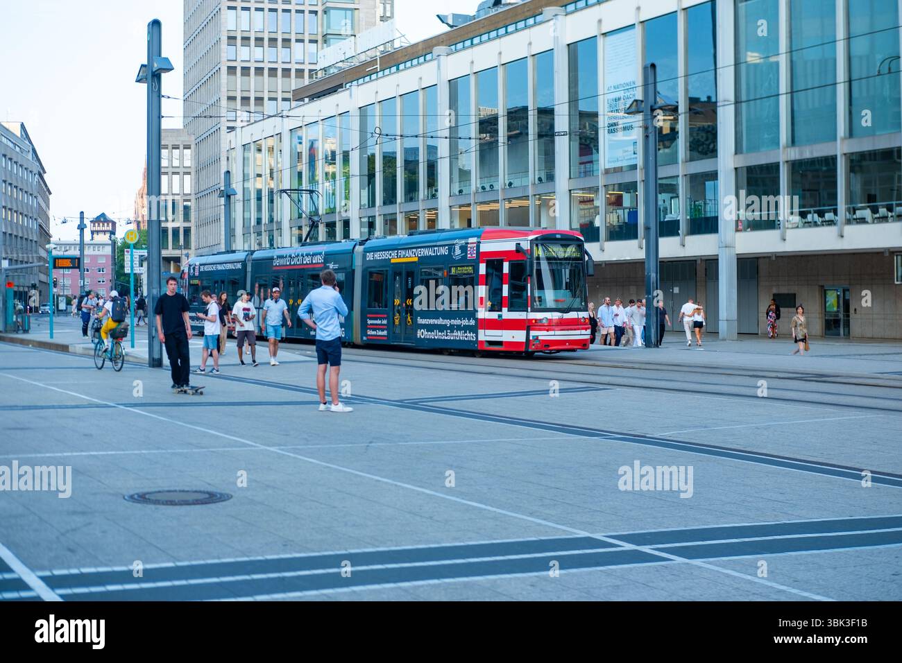 Trams in Frankfurt am Main, Germany, Skateboarder in action near tram ...
