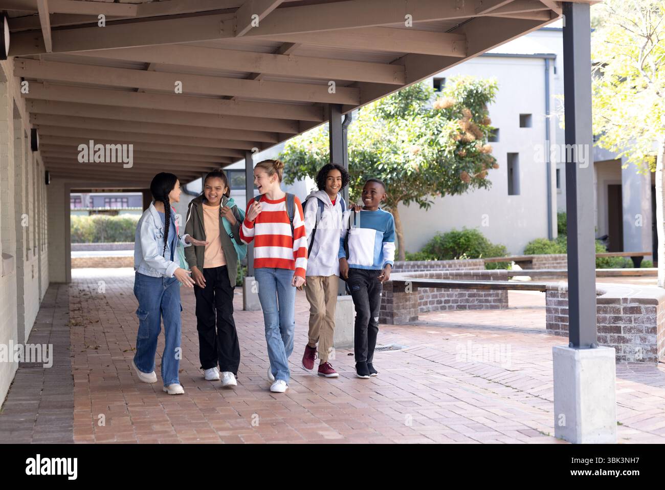 Classmates laughing together walking hi-res stock photography and ...