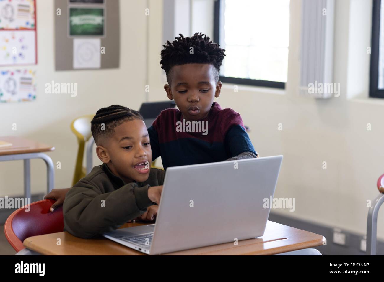 School diverse boys using hi-res stock photography and images - Alamy