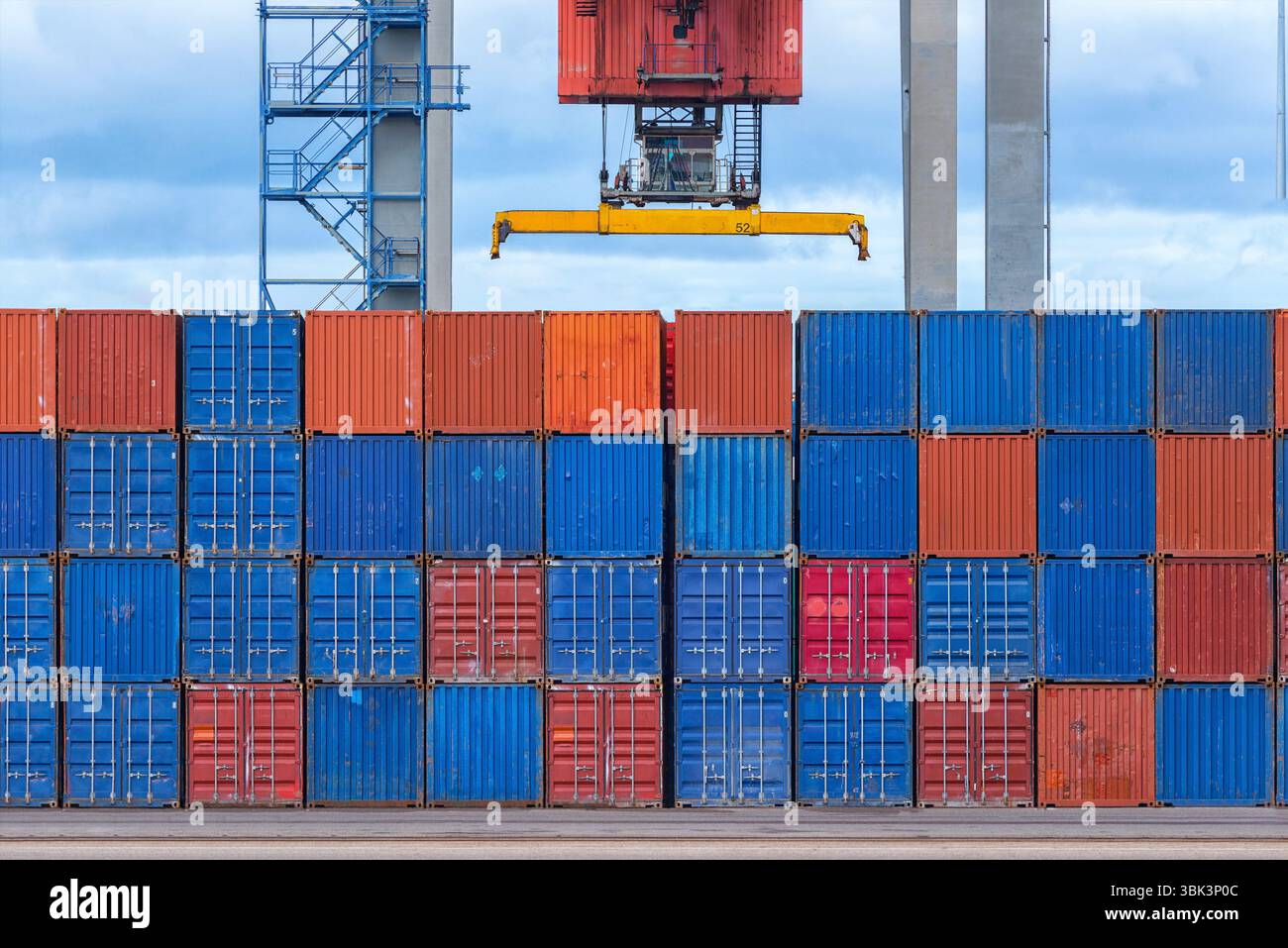 Lots of Cargo containers in shipyard stacked Stock Photo - Alamy