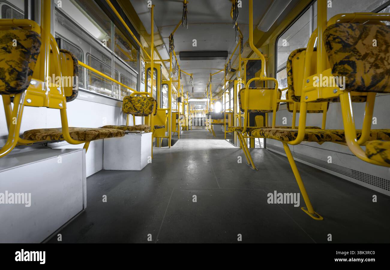 Angle shot of tram interior with yellow seats Stock Photo - Alamy