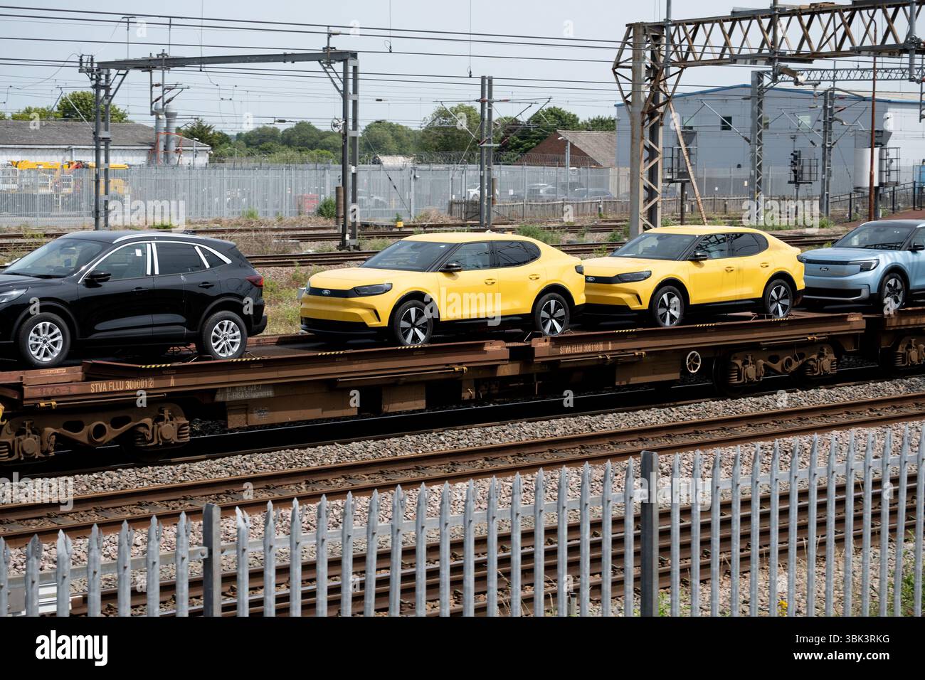 New yellow Ford Capri cars transported by rail, Rugby, Warwickshire ...