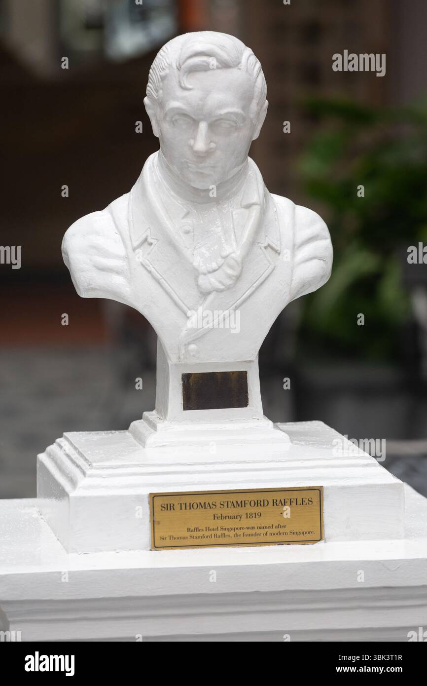 Vertical view. White contemporary statue of Sir Stamford Raffles, a British colonial official ...