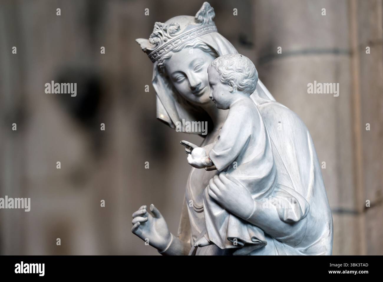 Auxerre cathedral. The crowned Virgin Mary carrying the baby Jesus in ...