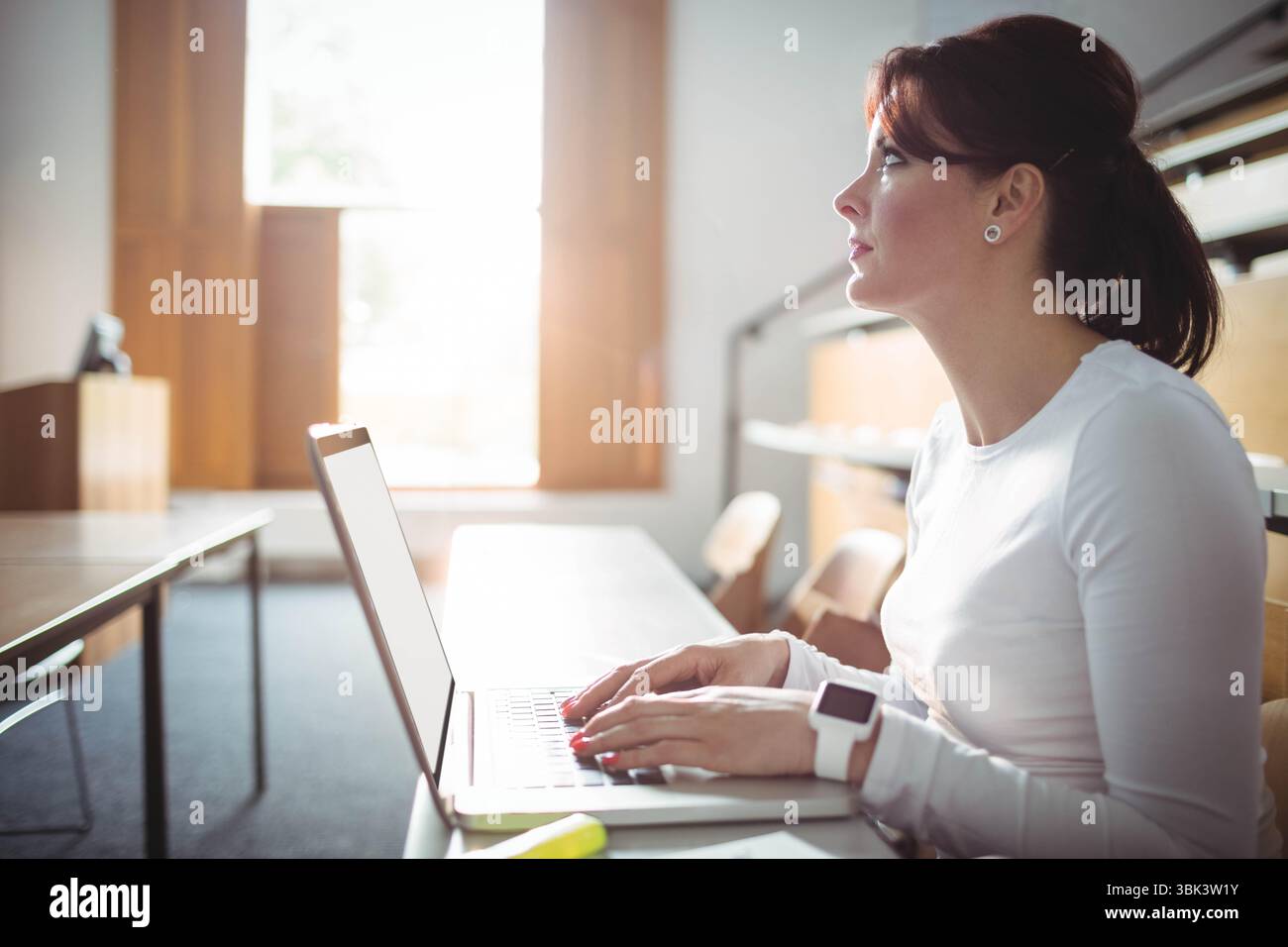 Woman student reviewing papers hi-res stock photography and images - Alamy