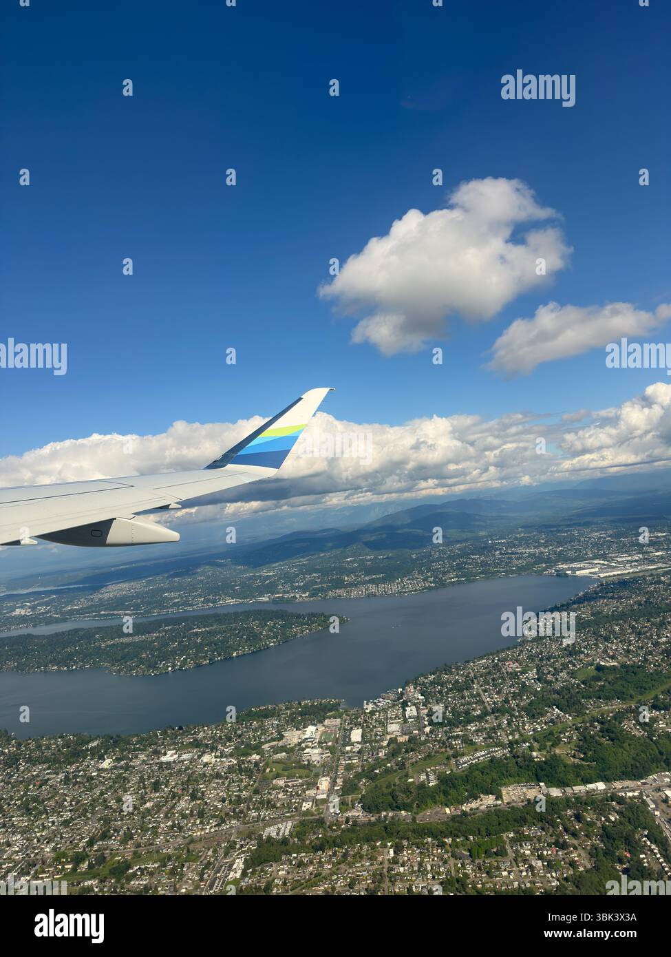 Seattle, USA - 12 MAY 2025 - A Plane taking off over properties and ...