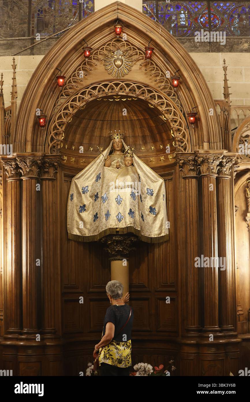 Notre Dame catholic cathedral, Chartres, France. Faithful touching the ...