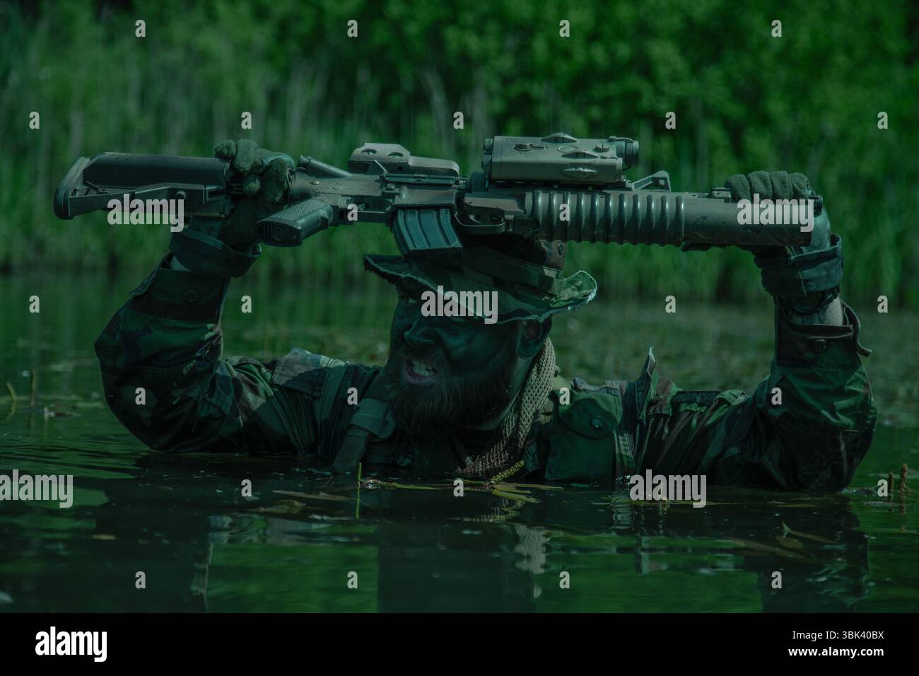 Military action in dense forest hi-res stock photography and images - Alamy