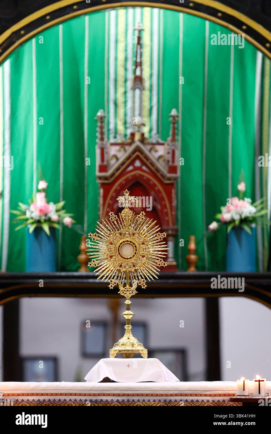Monstrance for worship at a Catholic church ceremony. Adoration to the ...