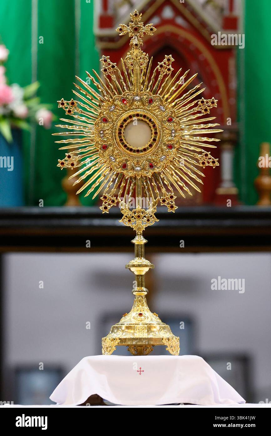 Monstrance for worship at a Catholic church ceremony. Adoration to the ...
