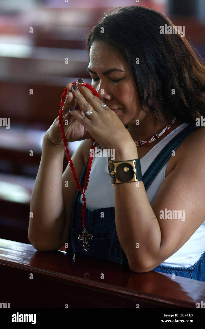Bahnar woman from ethnic minorities praying in church. Kon Tum ...