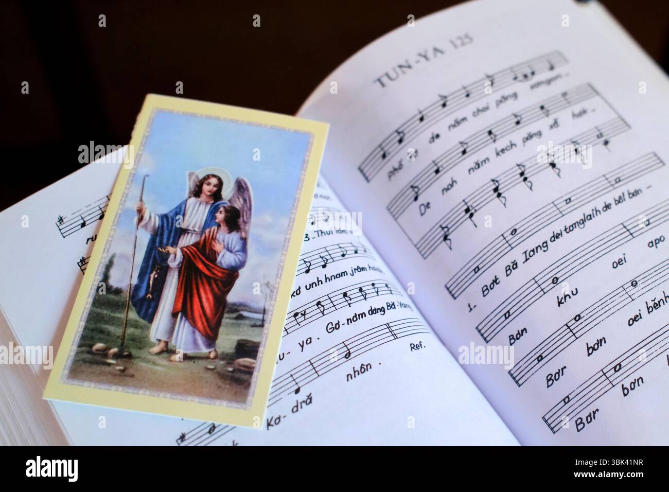 Catholic mass. Mass book with hymns and a religious image. Kontum ...