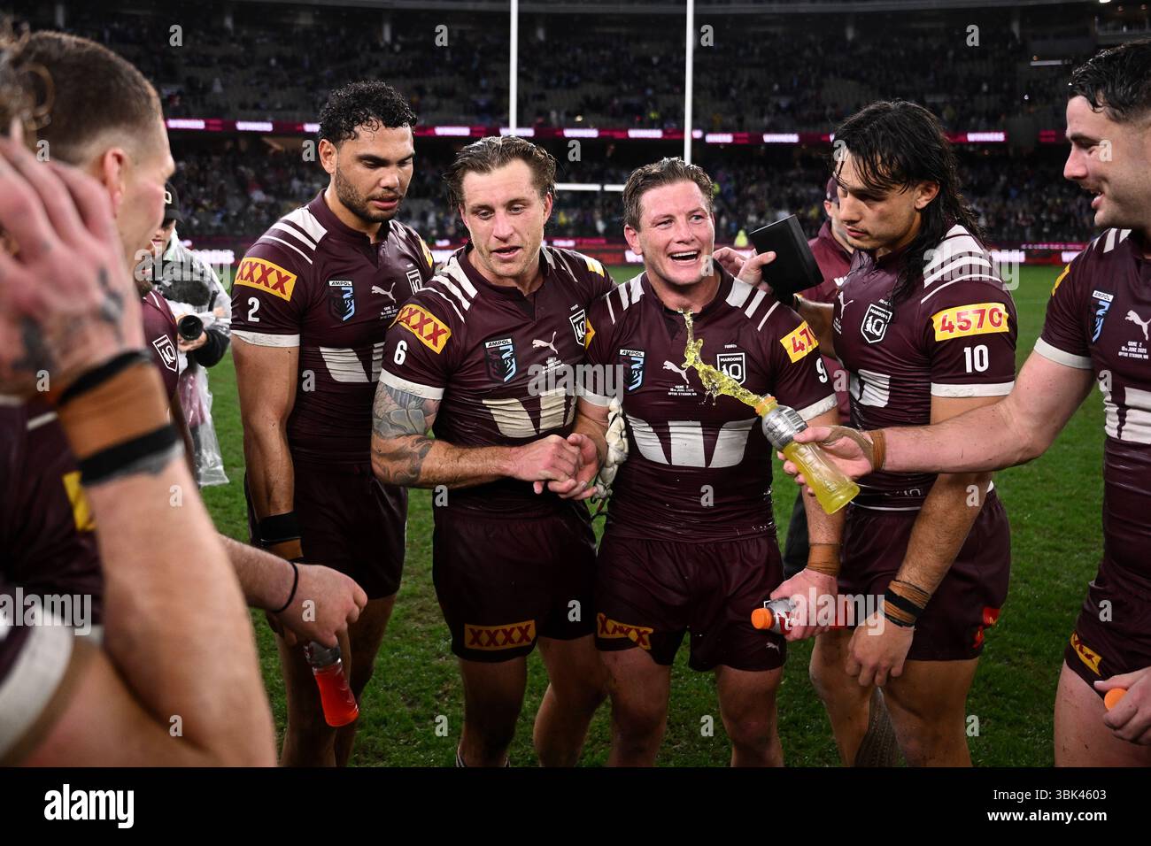 Maroons celebrate following their win in the State of Origin game two ...
