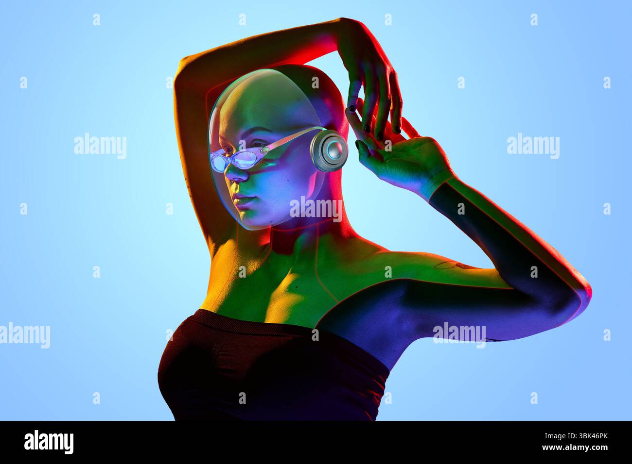 Woman with 3D goggles and neon visor poses in motion against soft blue ...