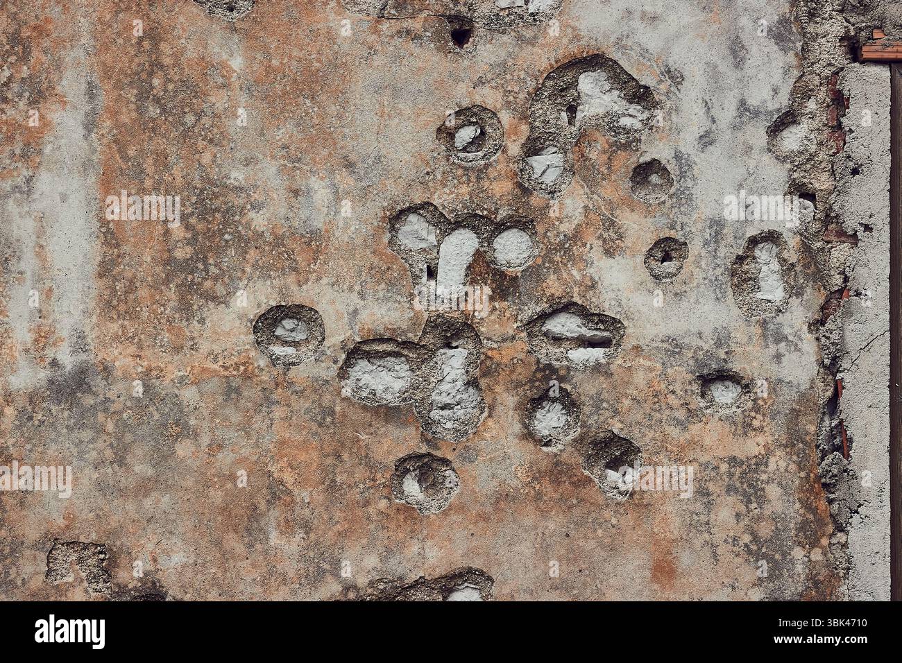 Damaged wall bullet hole after war Stock Photo - Alamy