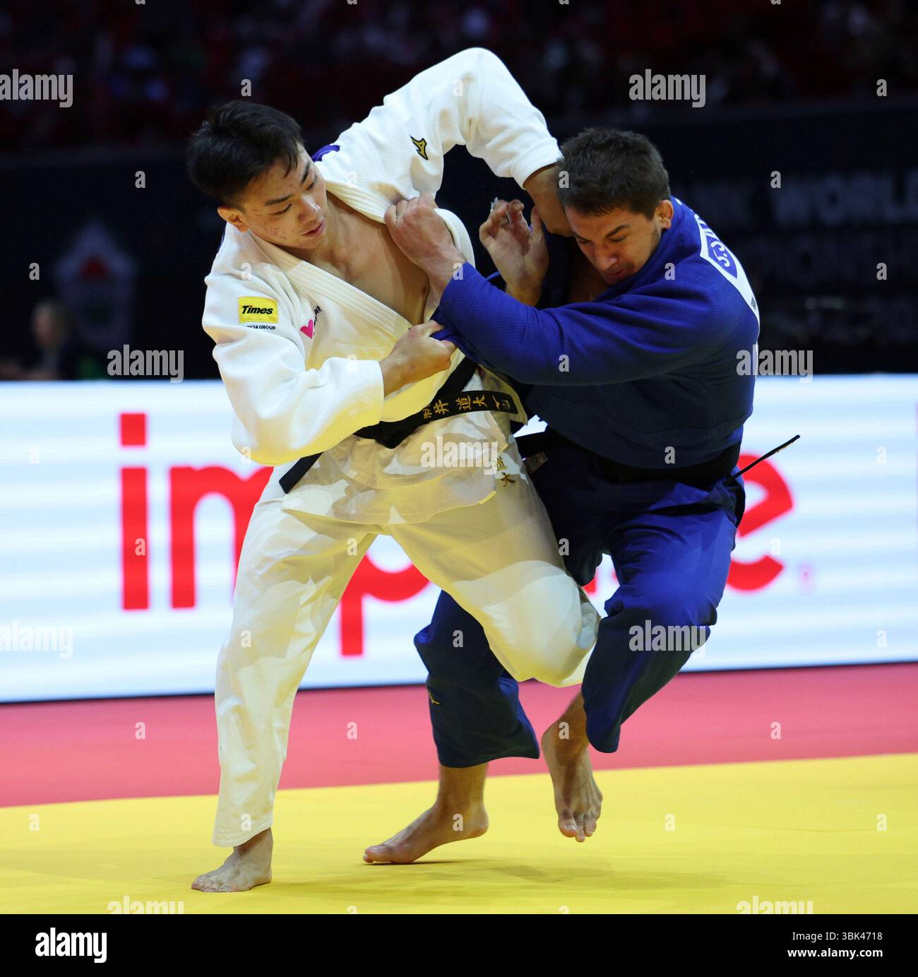 Dota ARAI of Japan (white) and Said SADRUDINOV of Bahrain compete ...