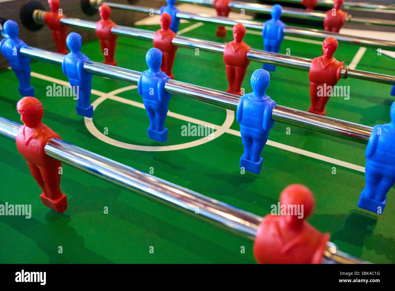 Bavaria, Germany - 10 June 2025: Red and blue figures on a green table ...